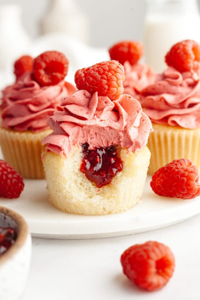 Easy Raspberry Almond Cupcakes with Raspberry Jam Filling - Alpine Ella